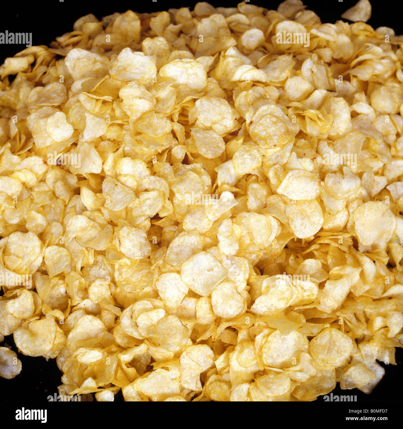 a pile of potato crisps Stock Photo - Alamy
