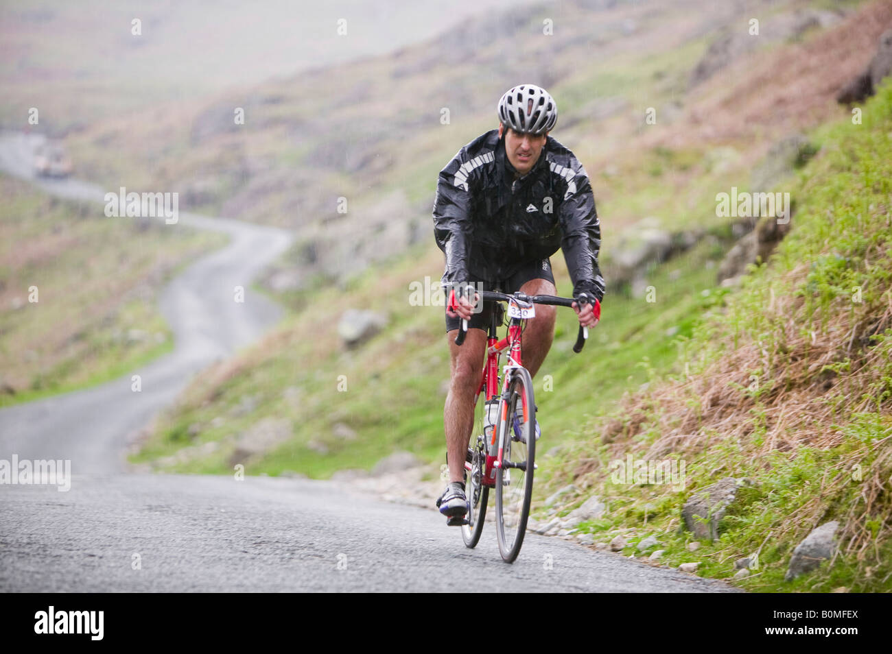 A cyclist descending Wrynose Pass on the Fred Whitton challenge in the ...