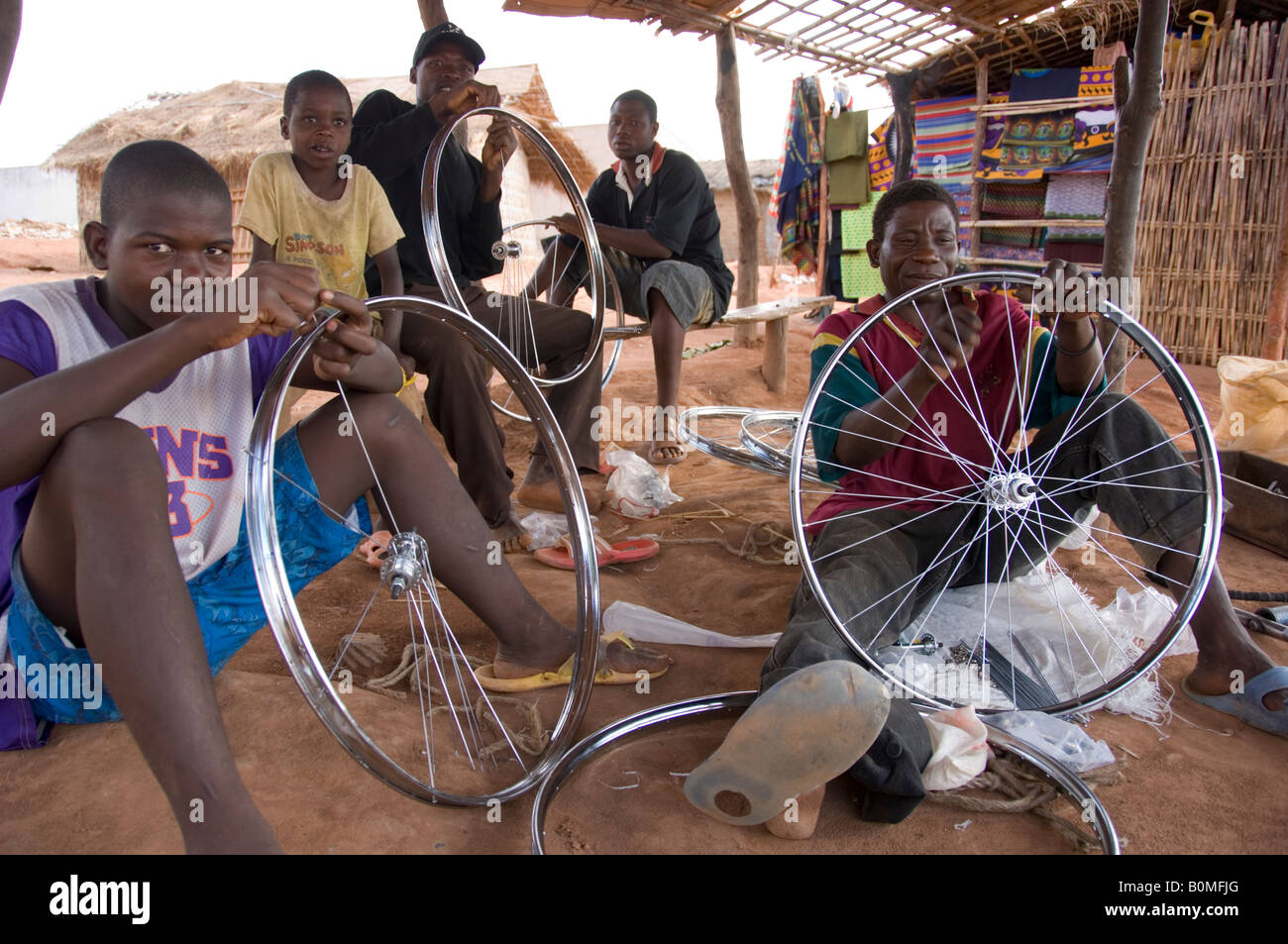 Production of a bicyle wheel on the market of Marrupa, Mozambique Stock ...