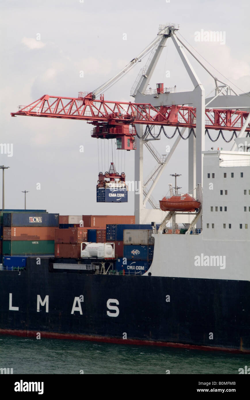 cargo ship shipping industry logisitics crane jib load unload loading ...