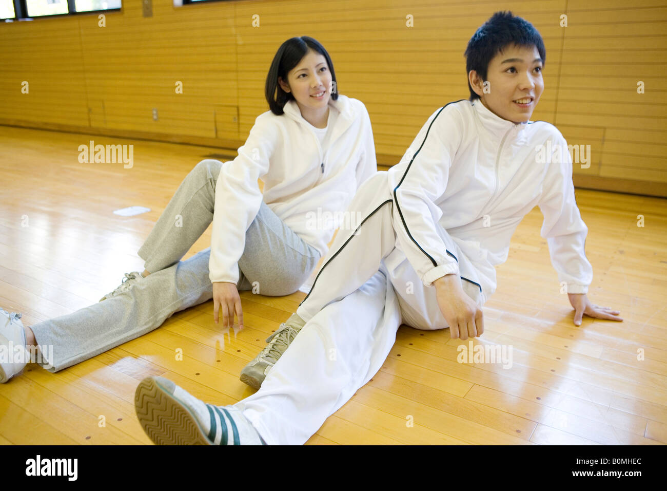 Asian man doing stretching exercises hi-res stock photography and ...