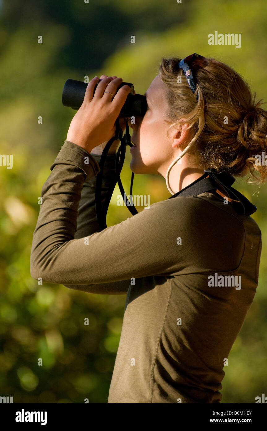 COSTA RICA Woman bird watching with binoculars in rainforest Stock ...