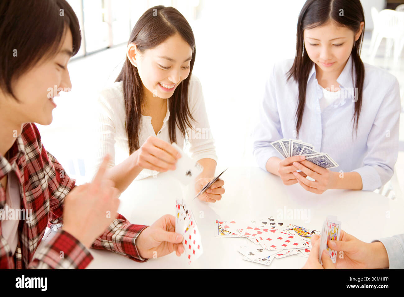 Japanese young playing a cards Stock Photo - Alamy