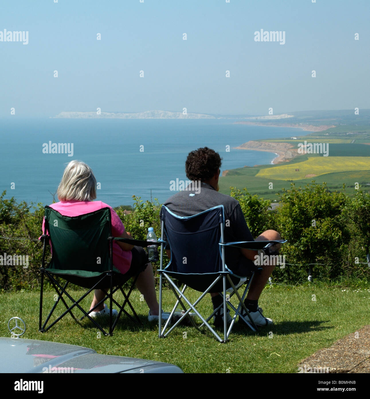 Tourists in camping chairs admire the view at Chale Isle of Wight ...