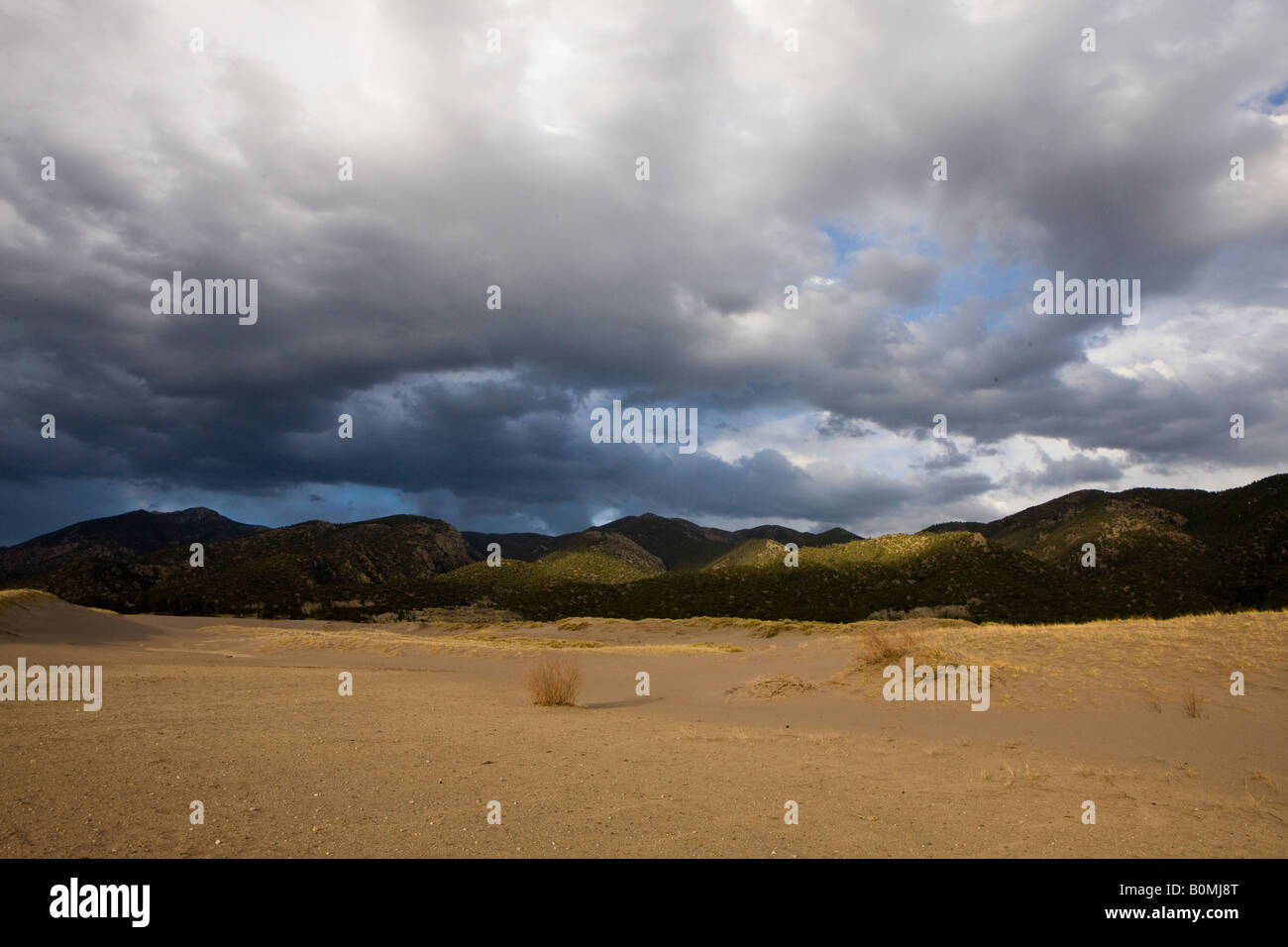 Colorful storm clouds form over the Sangre de Cristo Mountains viewed ...