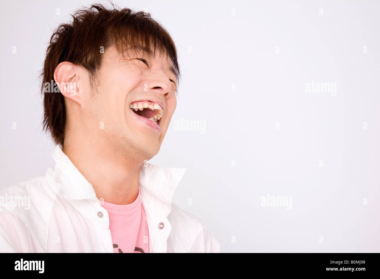 Smiling Japanese young man Stock Photo - Alamy