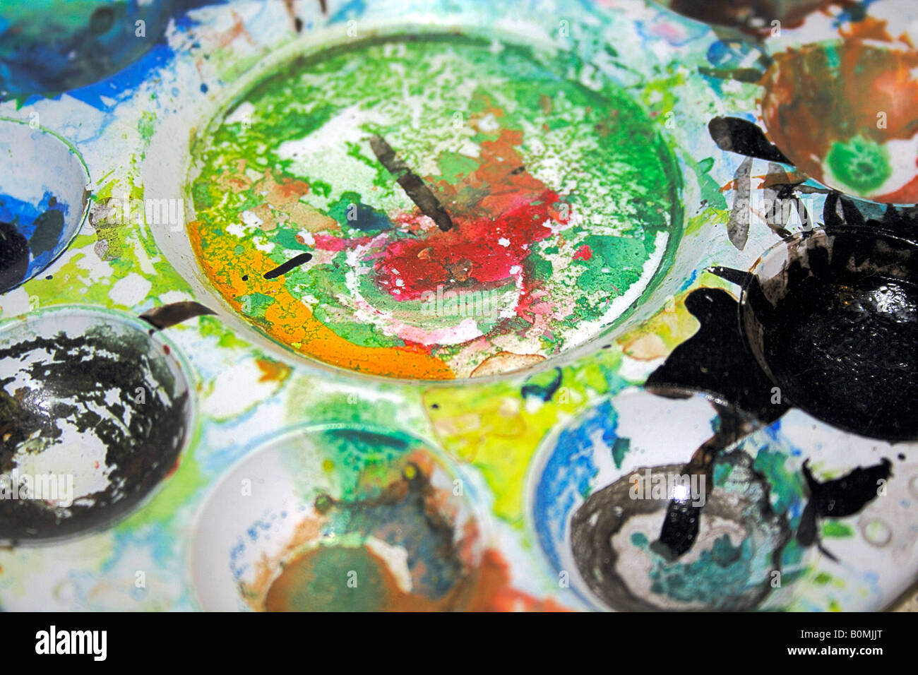 Used plastic paint palette with multicolored ink and paint stains Stock ...