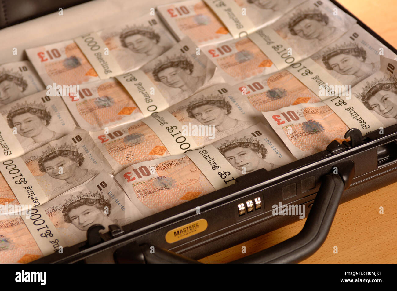 a closeup of a briefcase full of money Stock Photo - Alamy