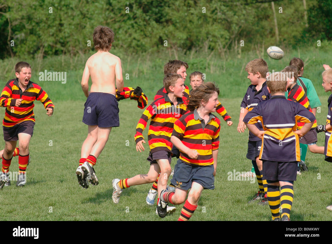 Children celebrate after winning a rugby game Stock Photo - Alamy