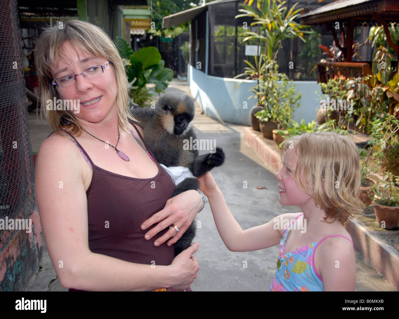 Nicky holding baby monkey, Lucy stroking it,snake farm and small zoo ...