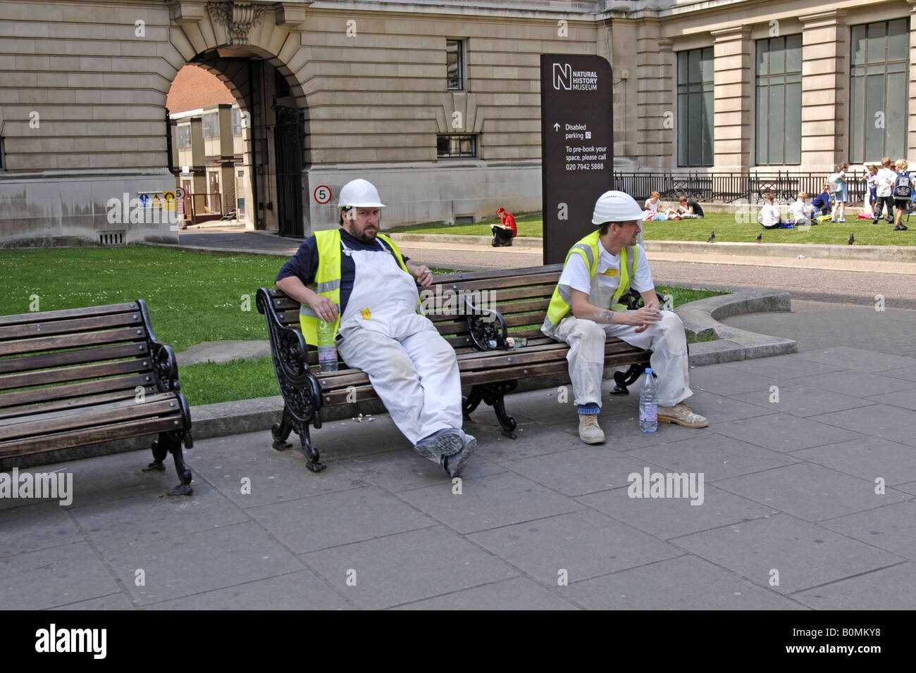 Two male workers sitting on a bench outside the Natural History Museum ...