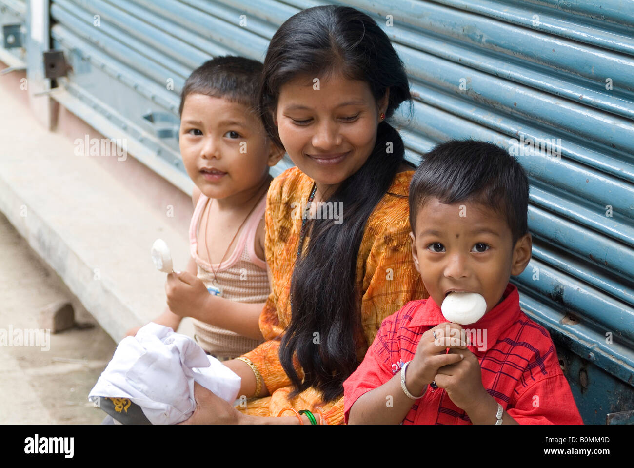 Mother and her two sons in Kathmandu, Nepal Stock Photo - Alamy