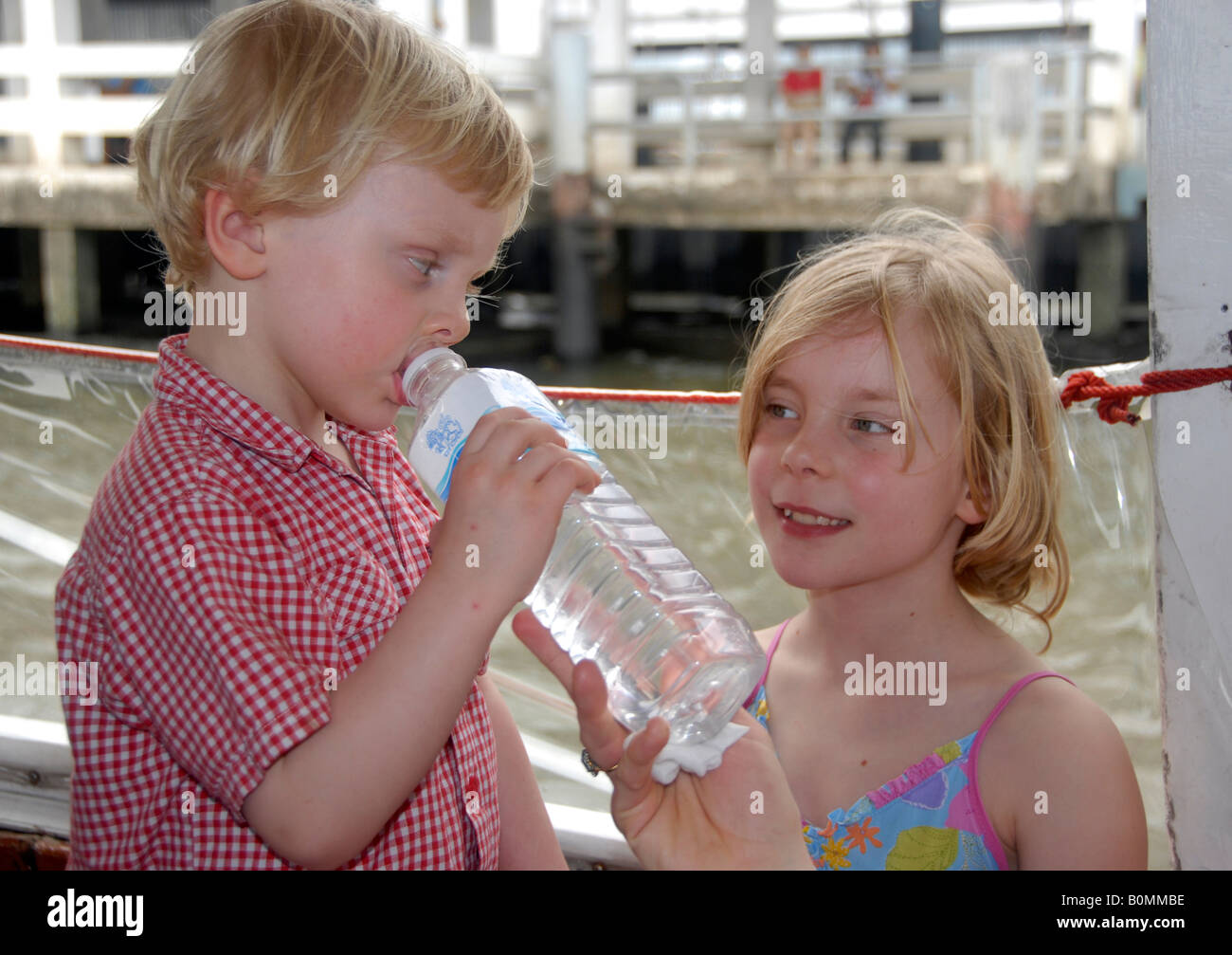 Wilf drinking water, Lucy at the riverside of the Chao Phaya, Bangkok ...
