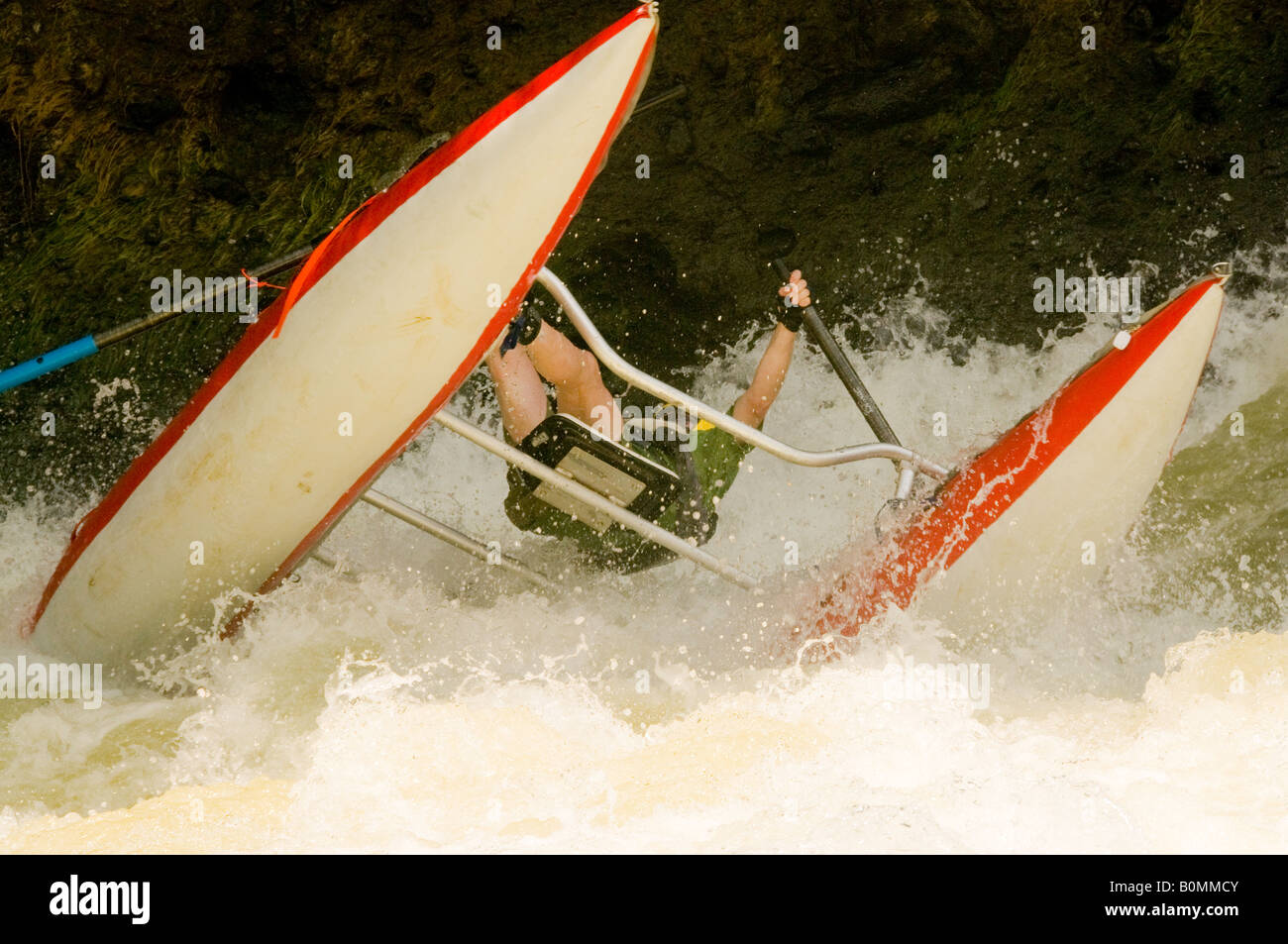 COSTA RICA Man flipping cataraft in the churning whitewater of the ...