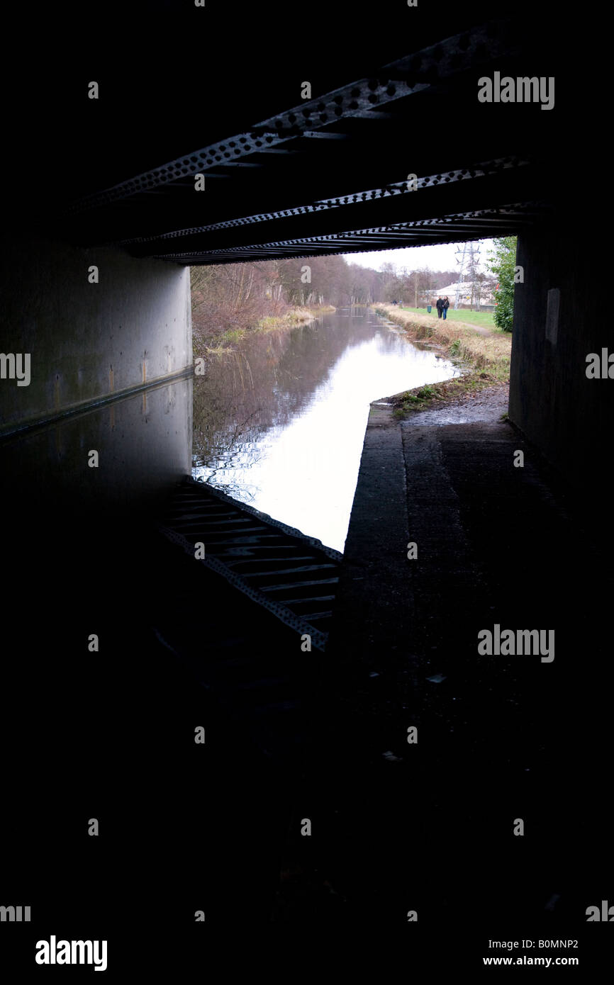 Tunnel under road bridge passing over the Basingstoke canal at Woking ...