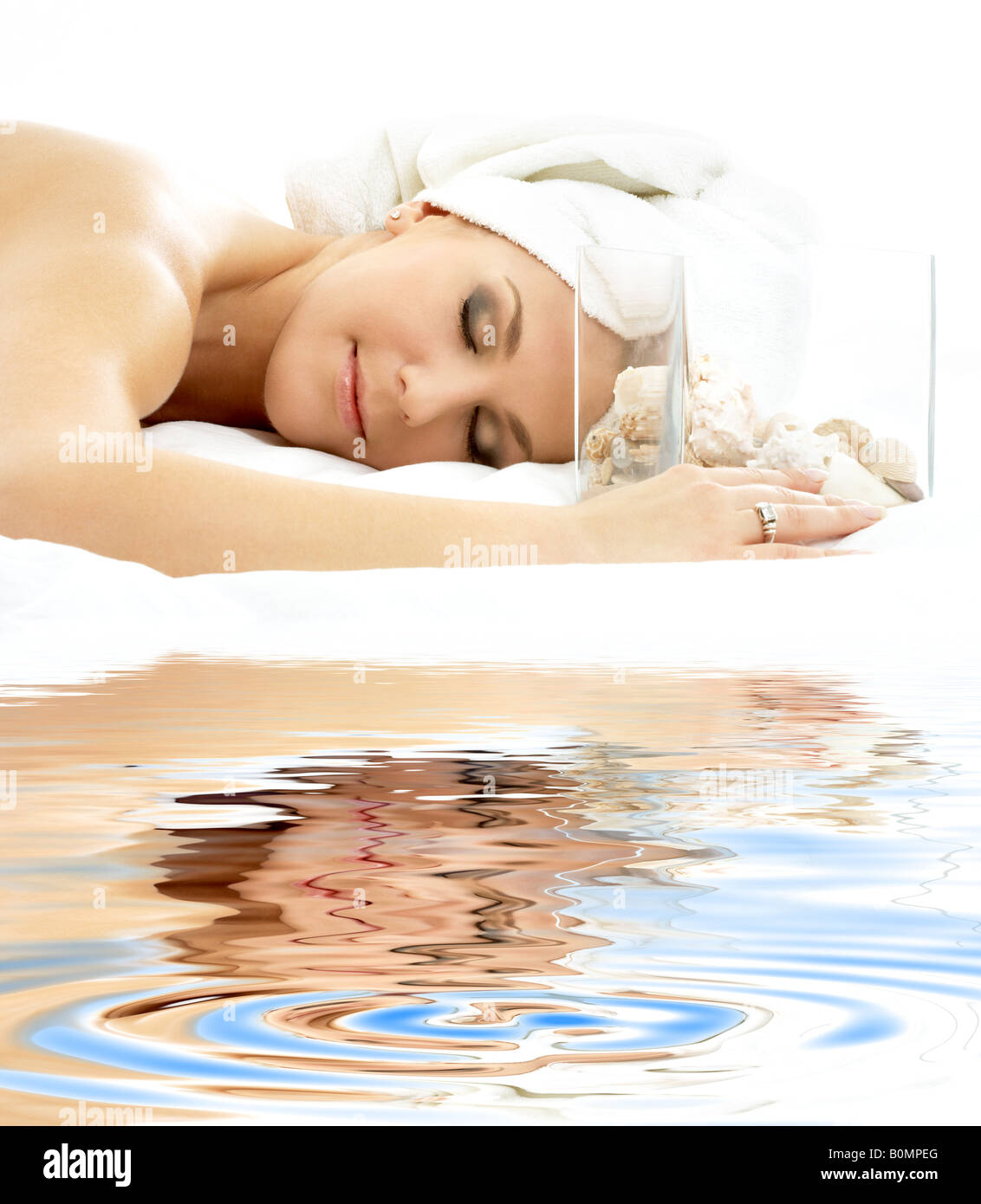 beautiful lady with sea shells in glass cube on white sand Stock Photo ...