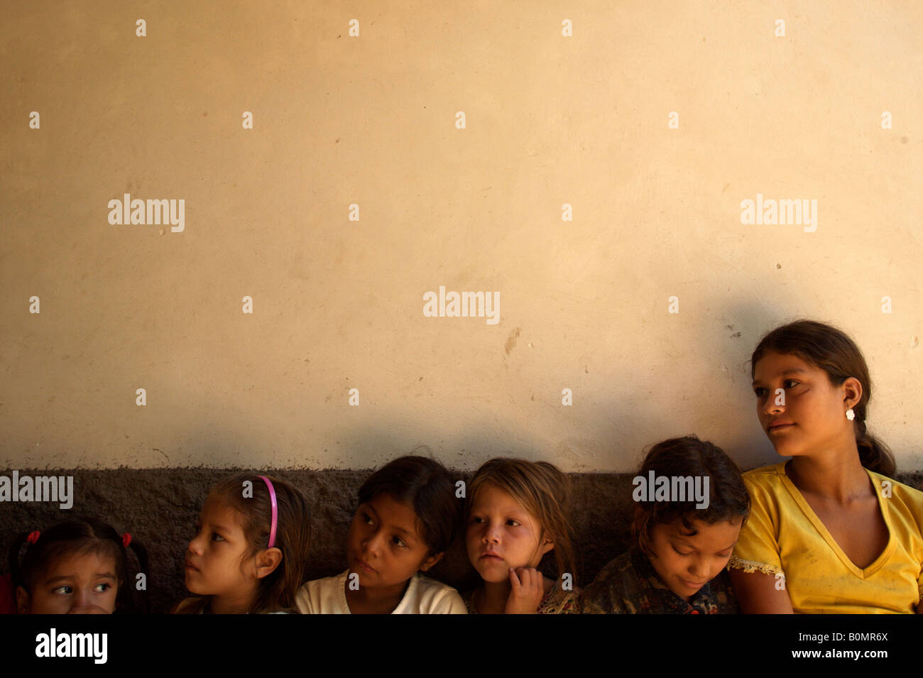Children pray while attending Sunday school put on by baptist ...