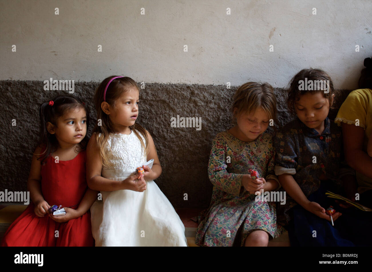 Children pray while attending Sunday school put on by baptist ...