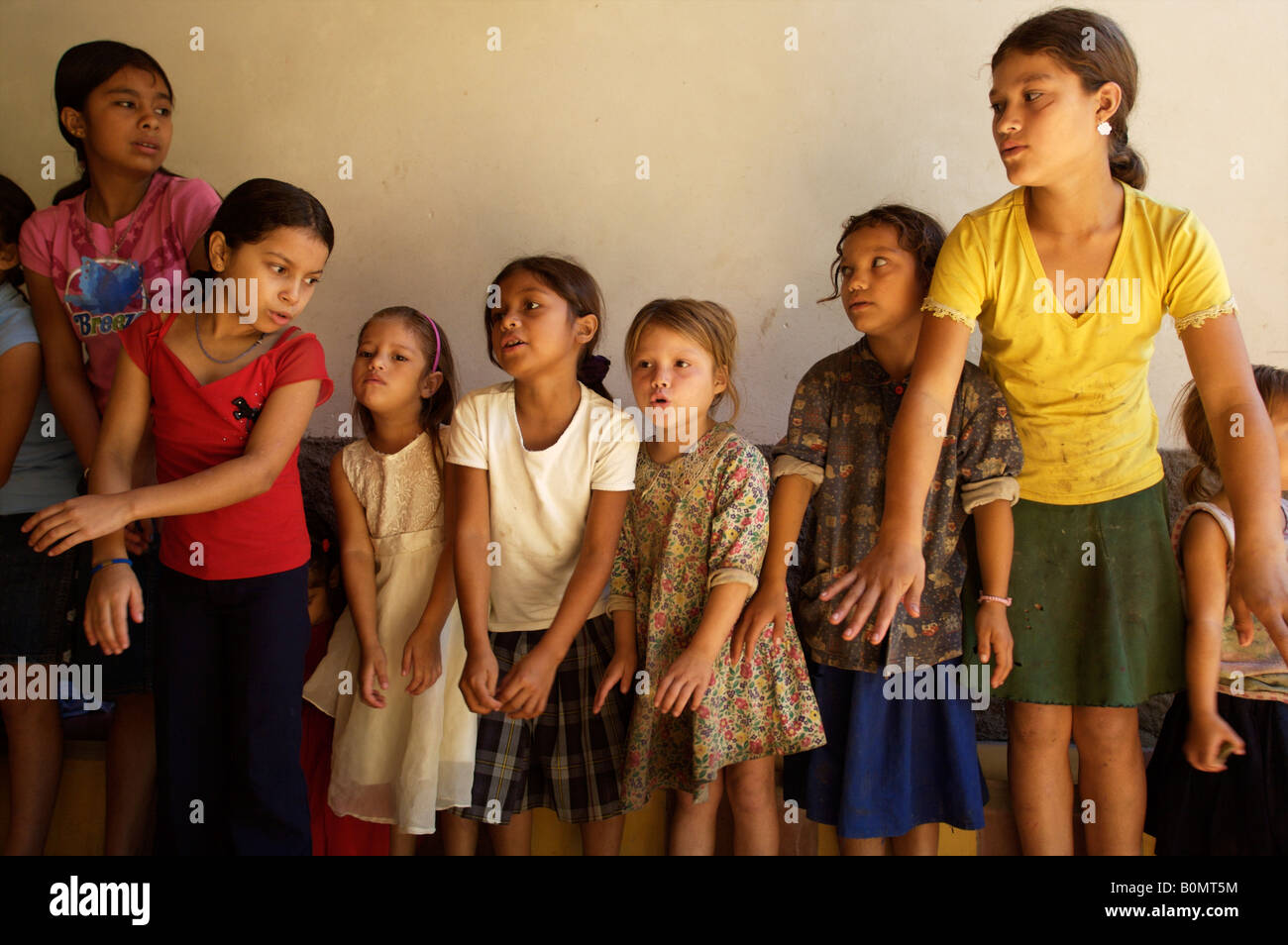 Children pray while attending Sunday school put on by baptist ...