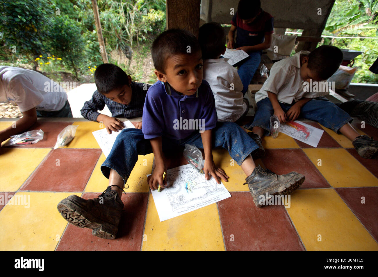 Children pray while attending Sunday school put on by baptist ...