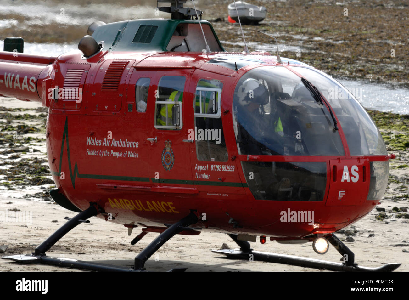Wales Air Ambulance helicopter and crew rescuing a casualty at Solva ...