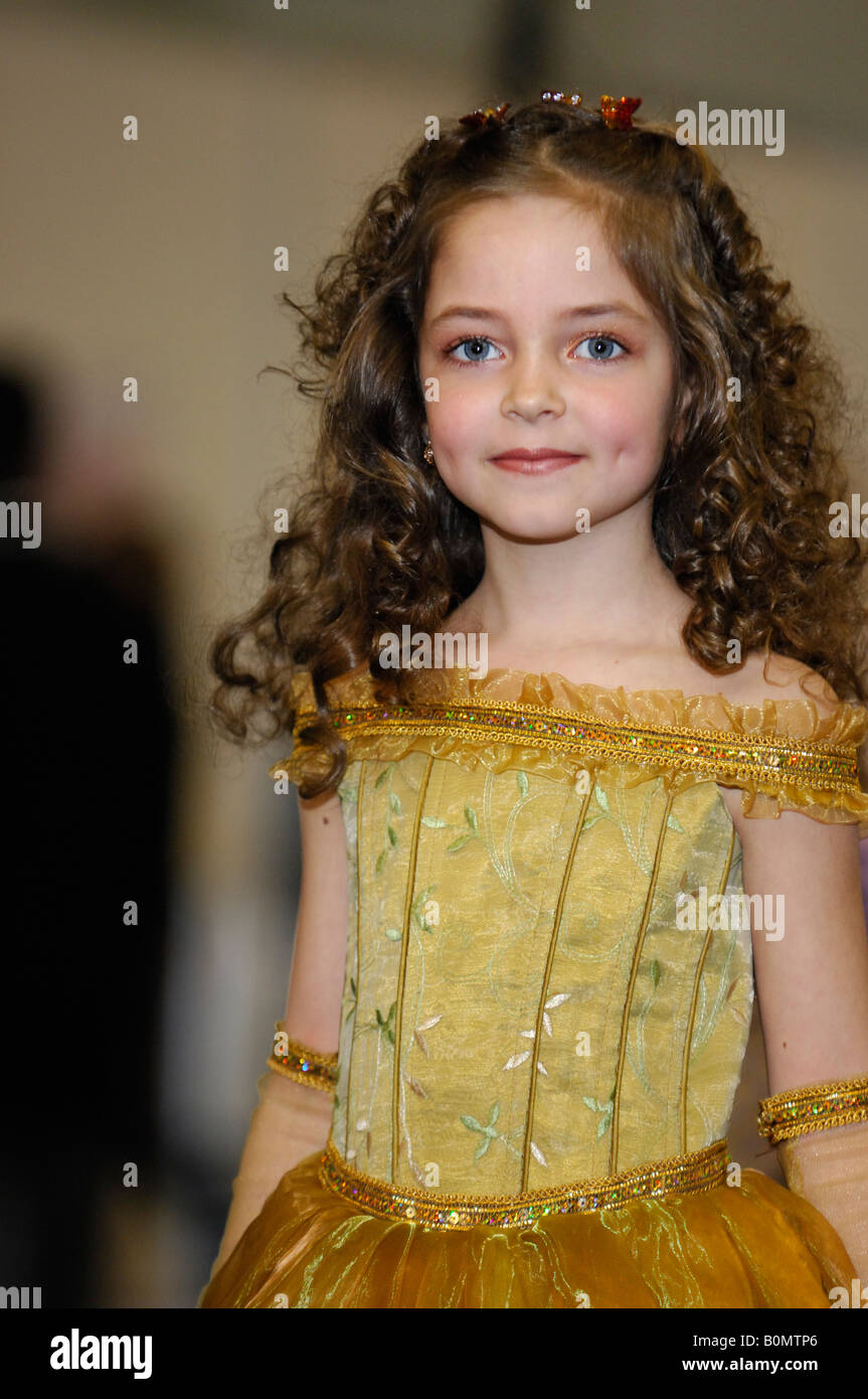 Beautiful smiling girl in a fancy dress Stock Photo - Alamy