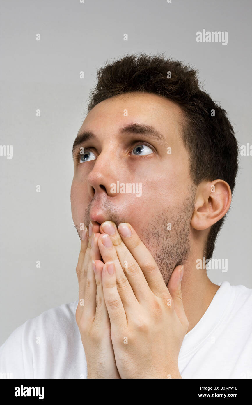 Portrait of a man praying Stock Photo - Alamy