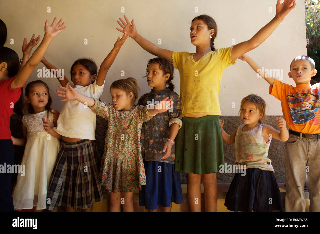 Children pray while attending Sunday school put on by baptist ...