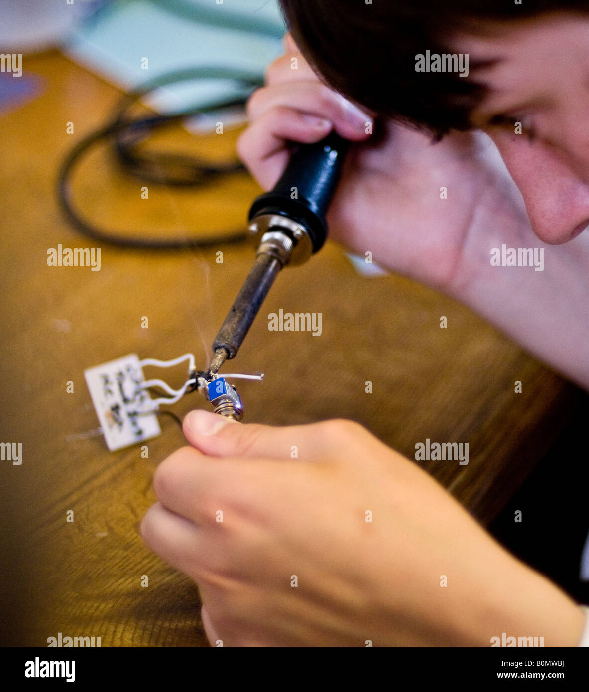 Education - A student working in an school electronics lesson Stock ...