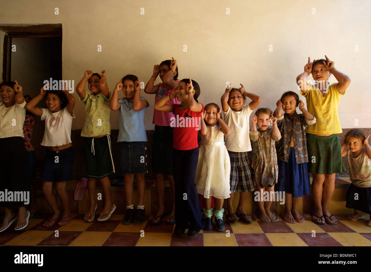 Children pray while attending Sunday school put on by baptist ...