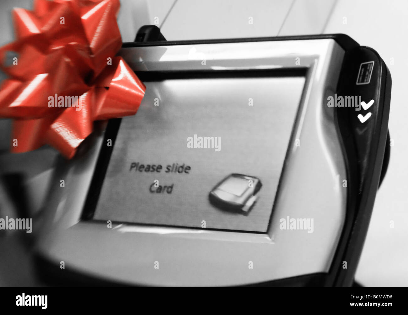 Credit card machine with red bow Stock Photo - Alamy