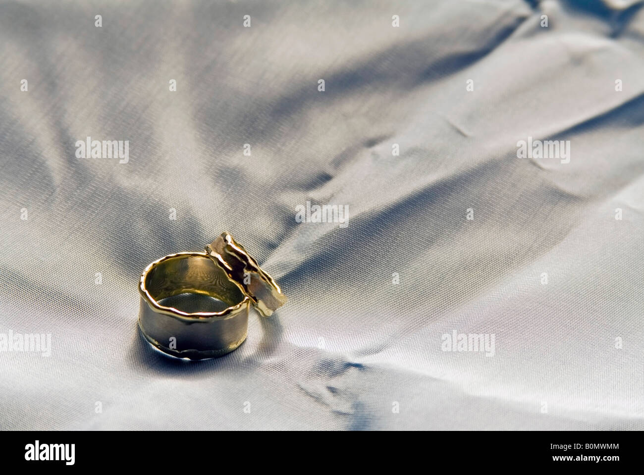 Beautiful unique wedding rings on a silk pillow Stock Photo - Alamy