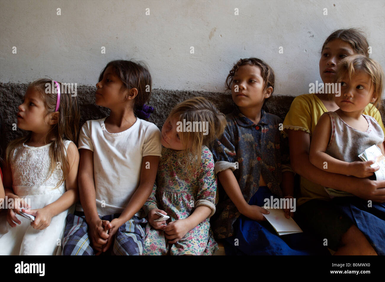 Children pray while attending Sunday school put on by baptist ...