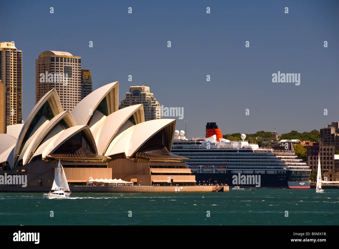 sydney opera house with queen victoria cruise ship in background during ...