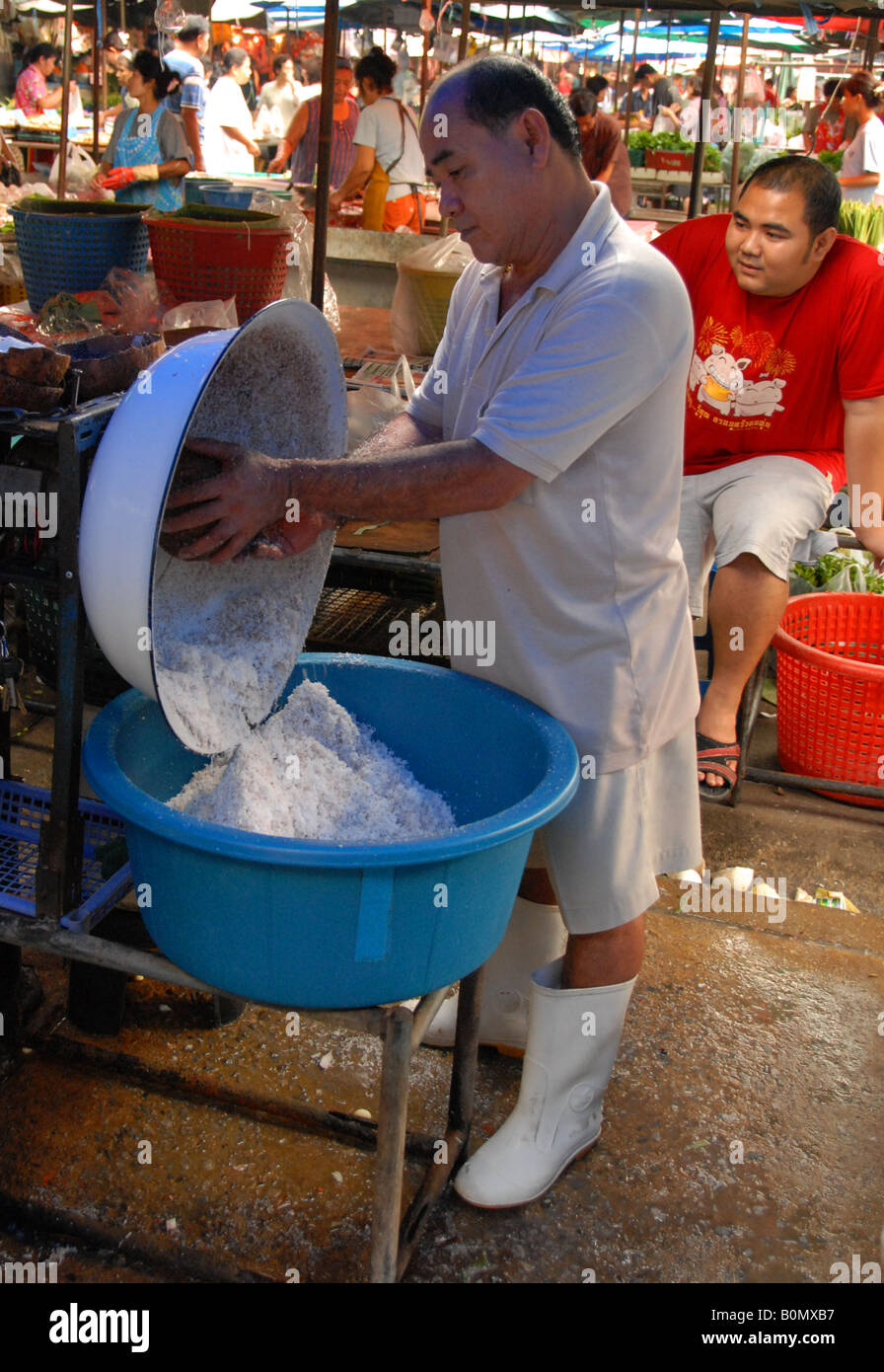 man with coconut grinder machine, fresh marlet in bangkok, thailand ...
