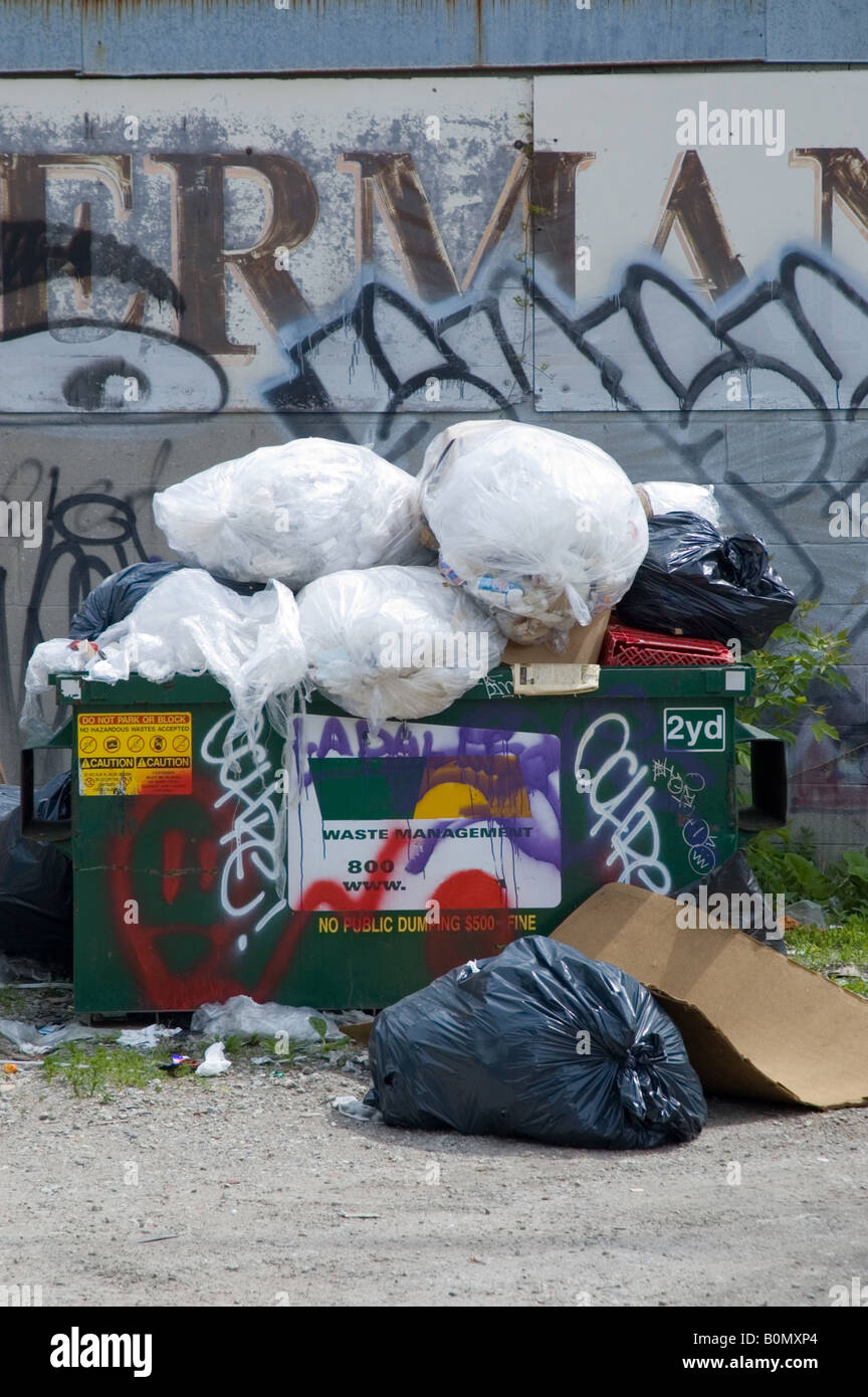 Over flowing garbage bin Stock Photo - Alamy