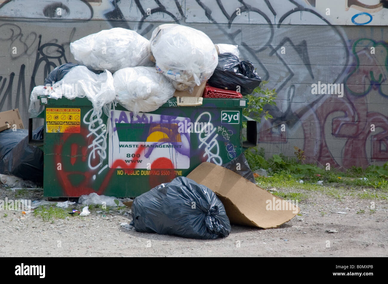 Over flowing garbage bin Stock Photo - Alamy