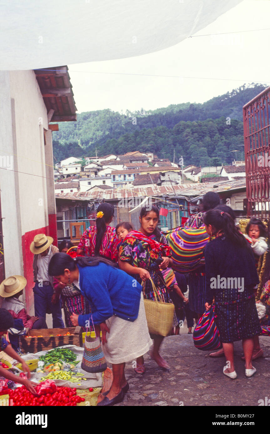 Market street scene with mayan people shopping for vegetables ...