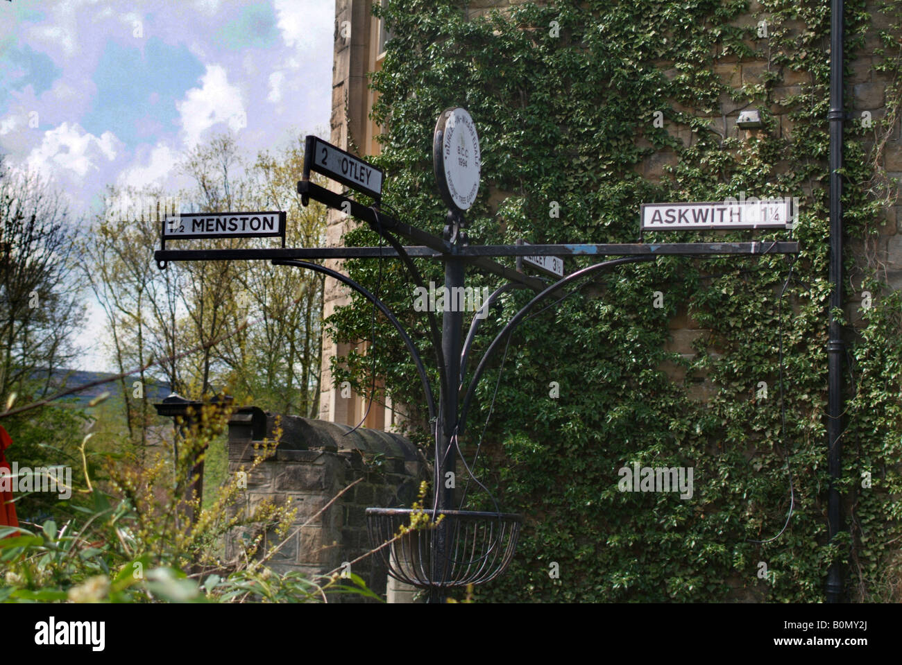 A wrought iron direction sign post seen as ornamentation in the grounds ...