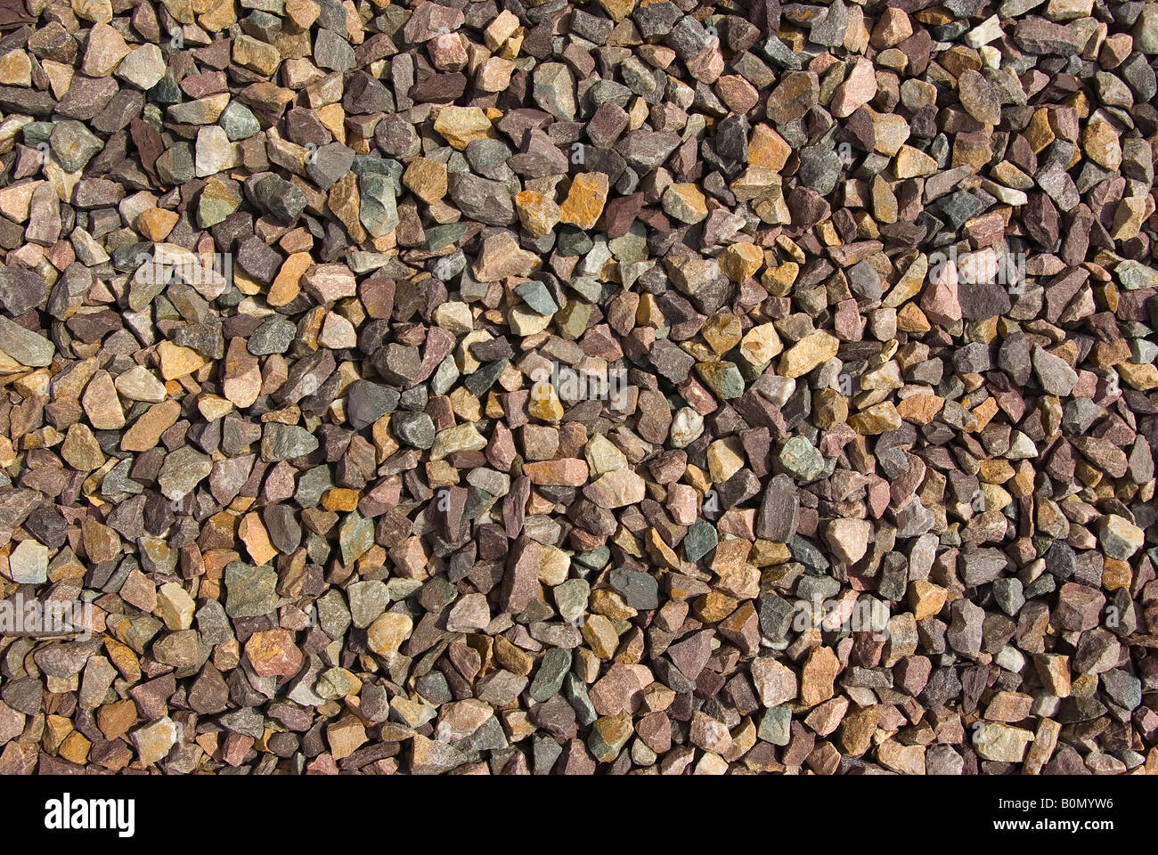 Full frame of crushed stone with red predominating Stock Photo - Alamy