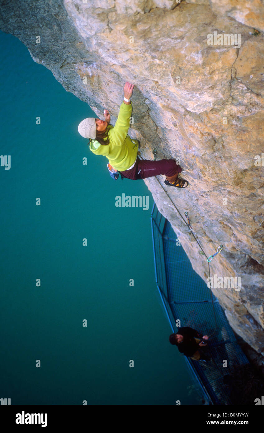 Rock climbing above water Stock Photo - Alamy