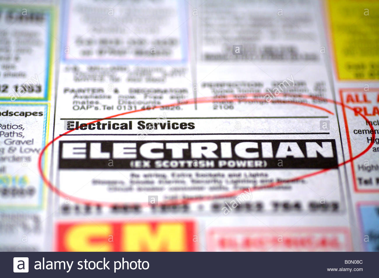 Electricans small ad in newspaper classifieds Stock Photo - Alamy