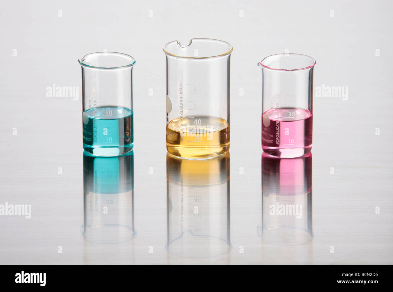 Threee beakers with different liquids in a lab Stock Photo - Alamy