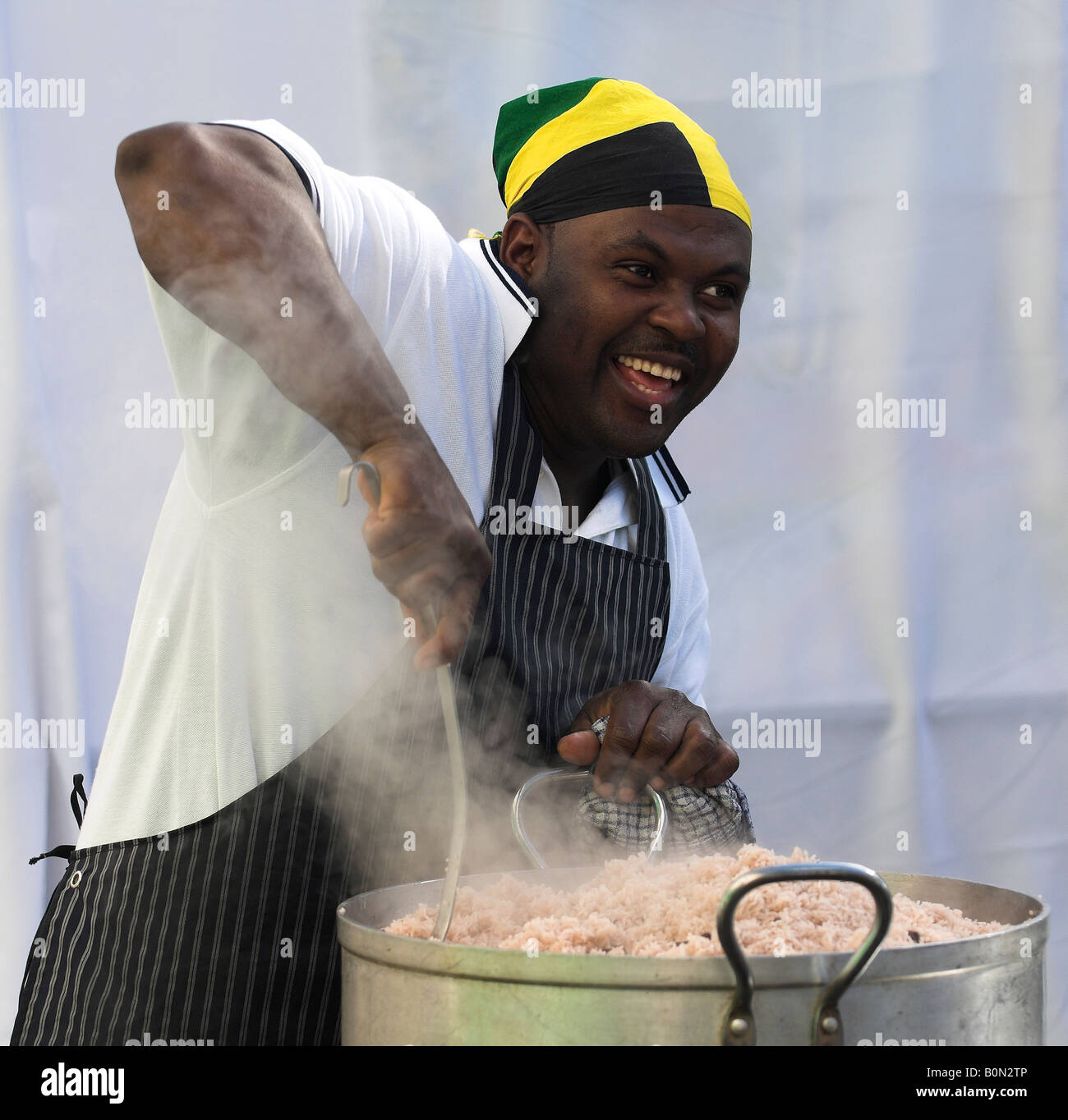 Man cooking rice, Notting hill Carnival Stock Photo - Alamy