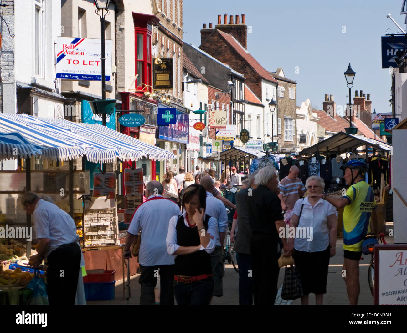 Market stalls and shoppers in a busy Wrawby Street Brigg North ...