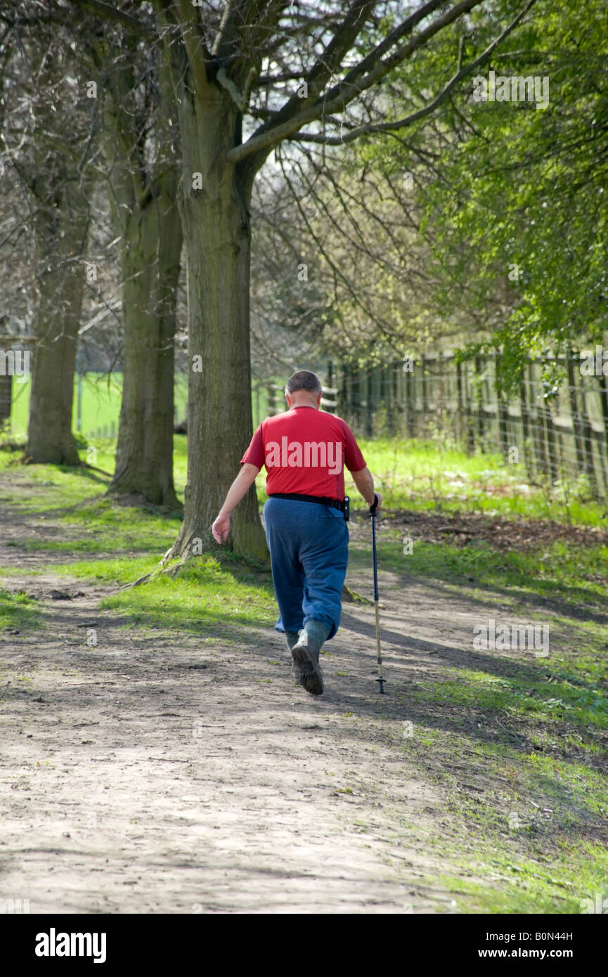 middle aged male walker on footpath Stock Photo - Alamy
