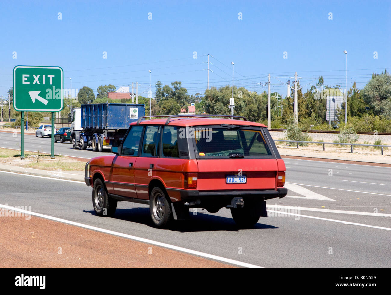 A 4WD leaving the highway by an exit lane. Mitchell Freeway, Perth ...
