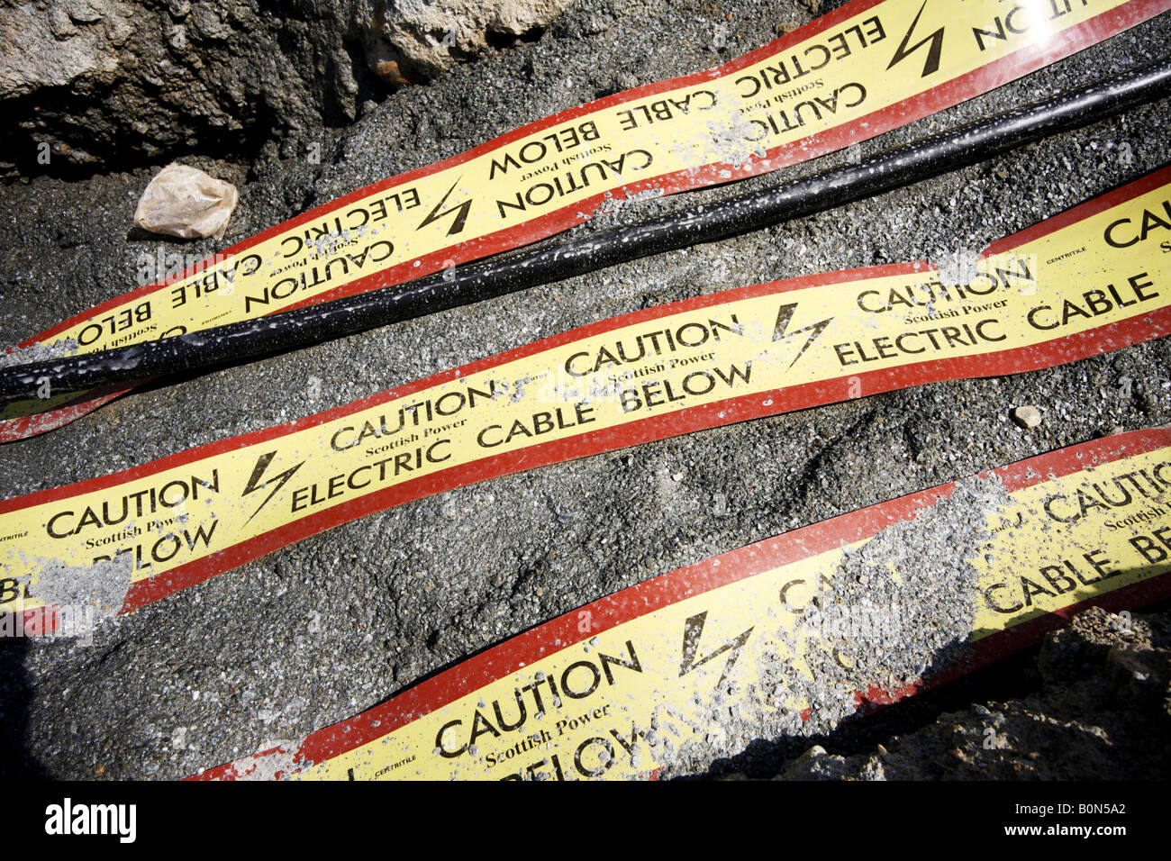 Exposed power cables in roadside trench Warning Tapes in Ground Caution ...
