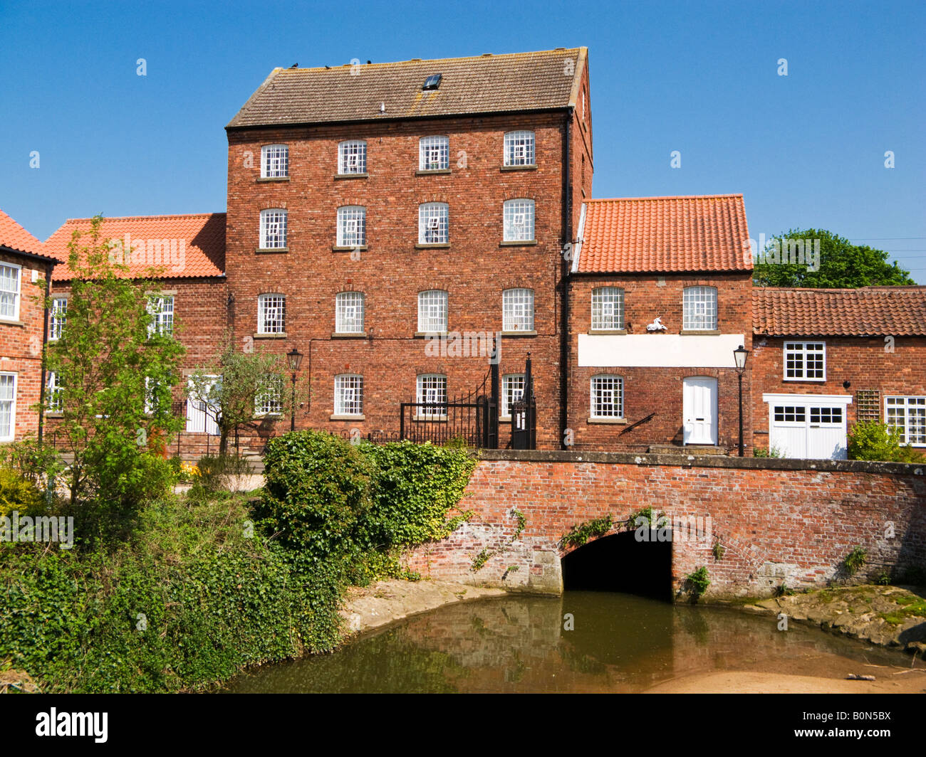 Victorian Church Mill on river Rase converted for housing and new ...