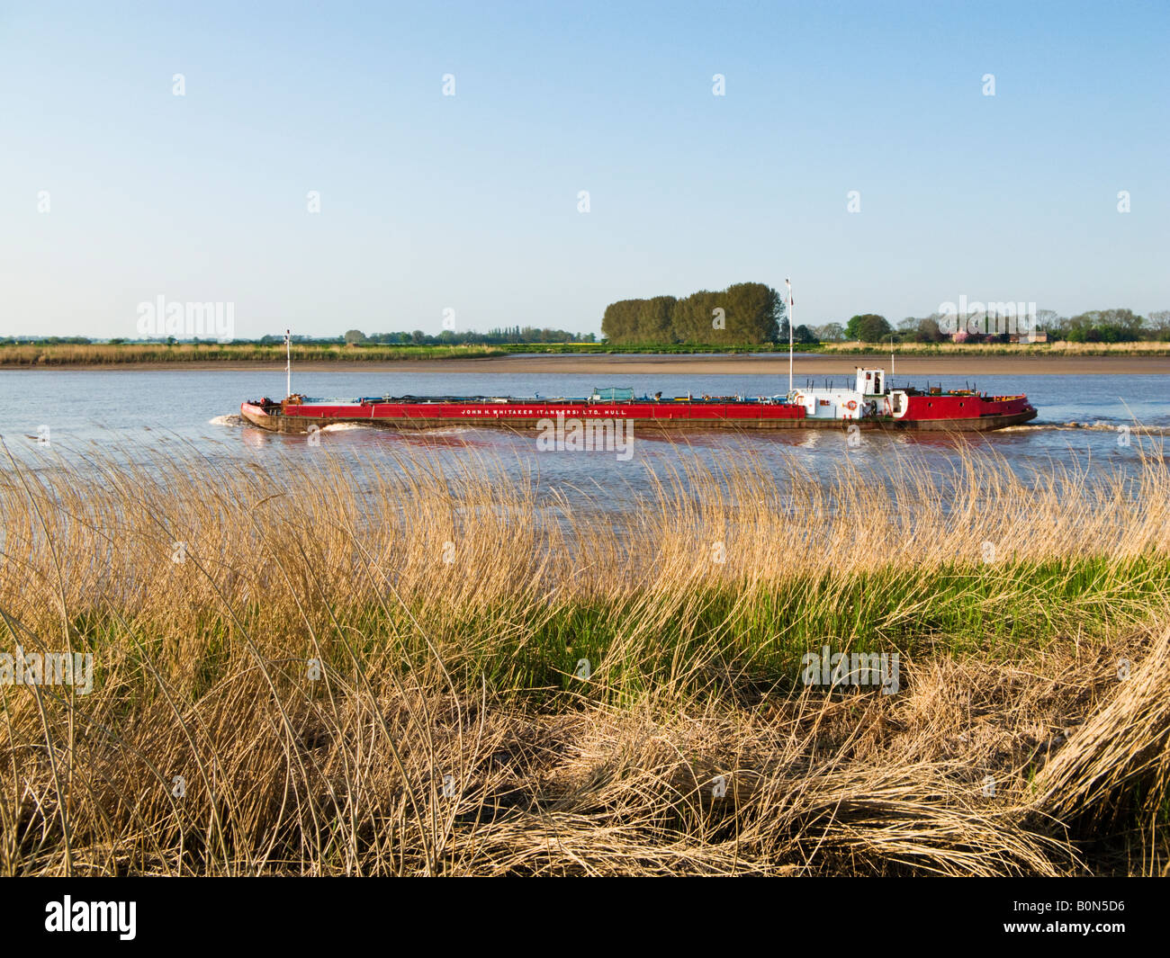 Tanker ship on the tidal River Ouse at Reedness, East Yorkshire, UK ...